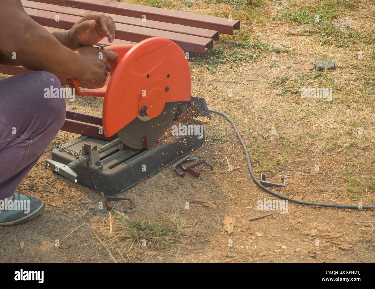 Worker use steel cutter machine cut steel Stock Photo - Alamy