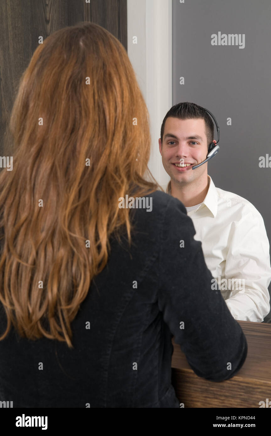 Customer at a service desk Stock Photo - Alamy