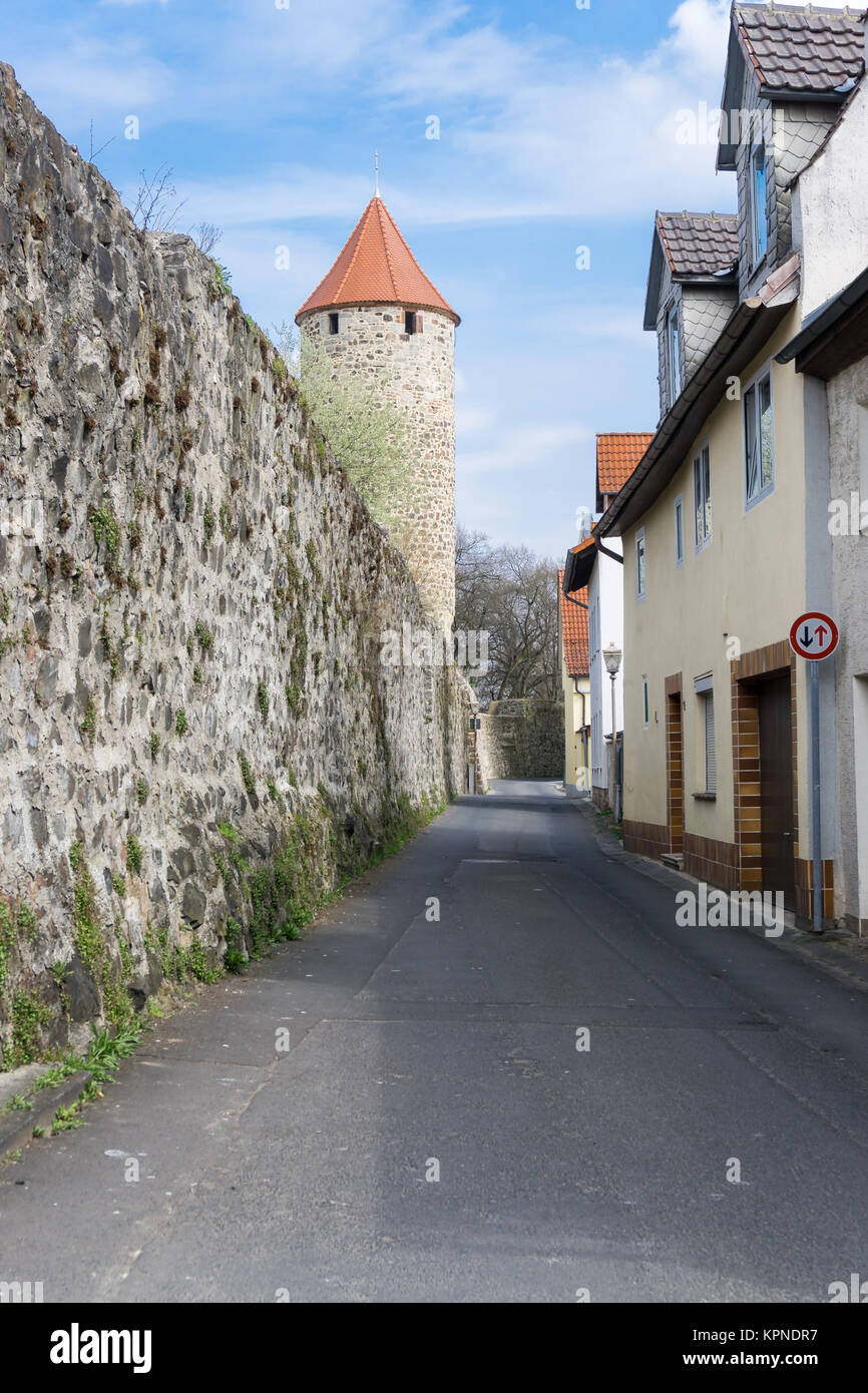 historical old town wall with fortified tower in a smallâ€”town ...