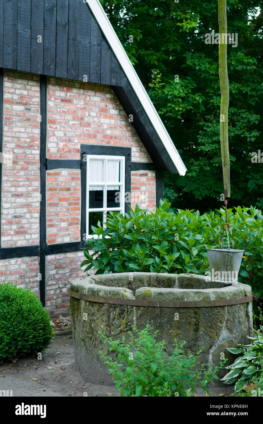 Old Farm Building with Well Stock Photo - Alamy