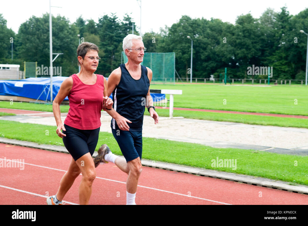 Older elderly woman running runner hi-res stock photography and images ...