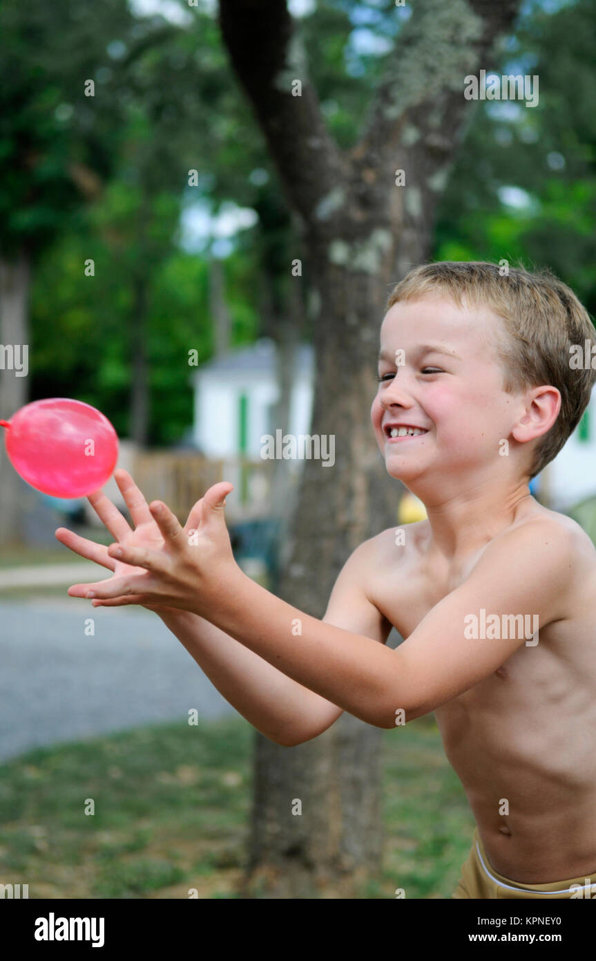 Catching The Balloon Stock Photo - Alamy