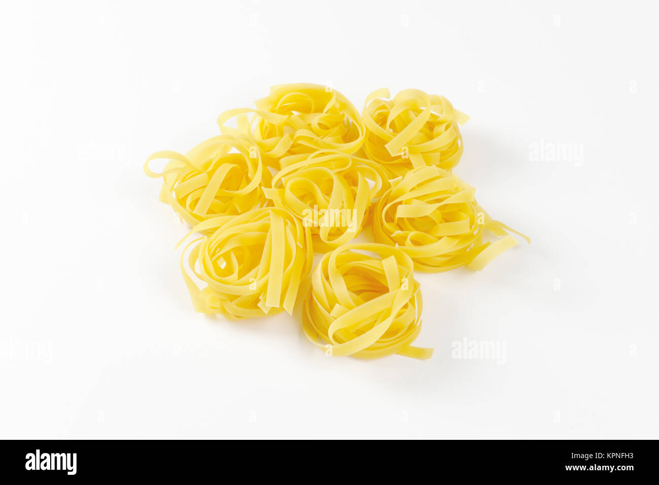 Dried tagliatelle pasta nests hi-res stock photography and images - Alamy