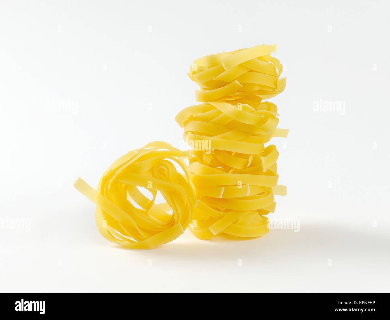 Dried tagliatelle pasta nests hi-res stock photography and images - Alamy