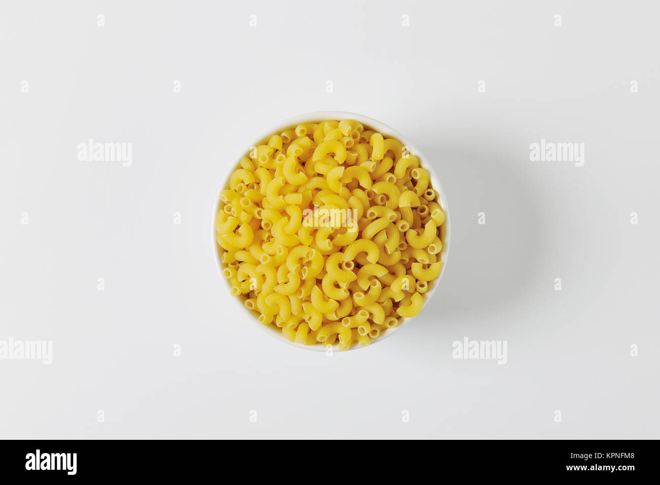 Bowl of dried macaroni Stock Photo - Alamy
