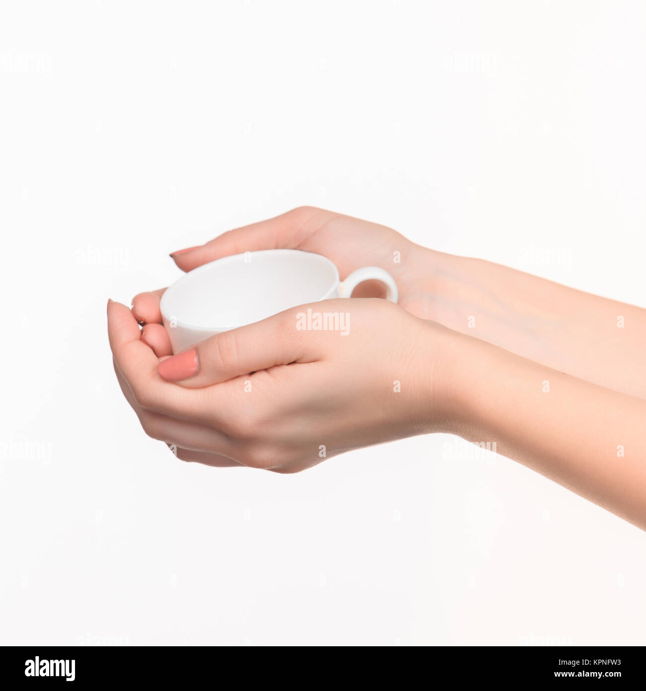 Woman hand with cup on white background Stock Photo - Alamy