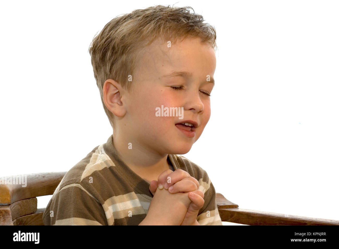 Little boy praying Stock Photo - Alamy