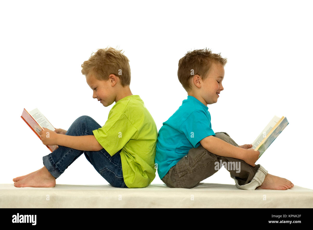 Two Happy Friends Reading Stock Photo - Alamy