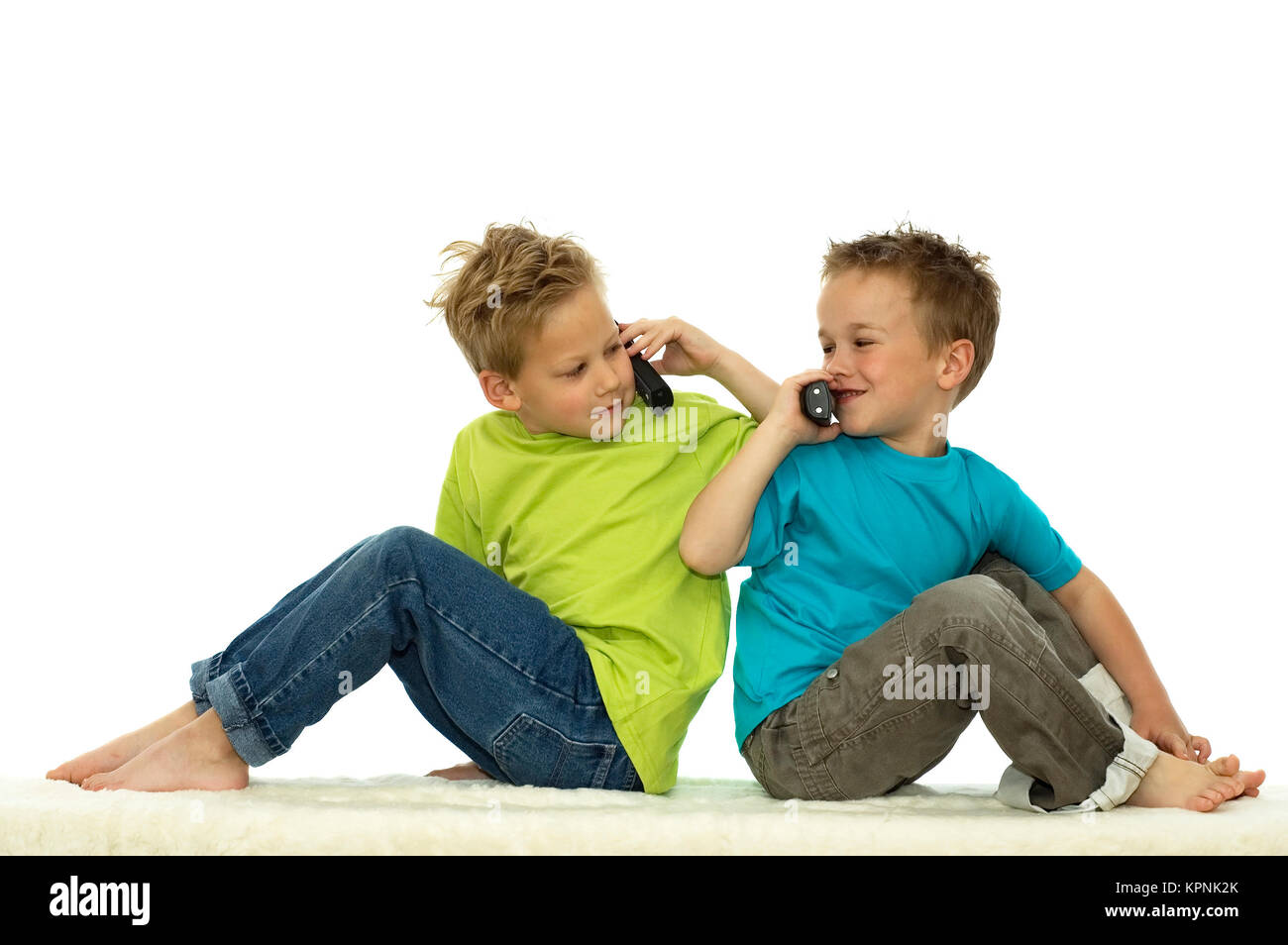 Two brothers talking together sitting hi-res stock photography and ...