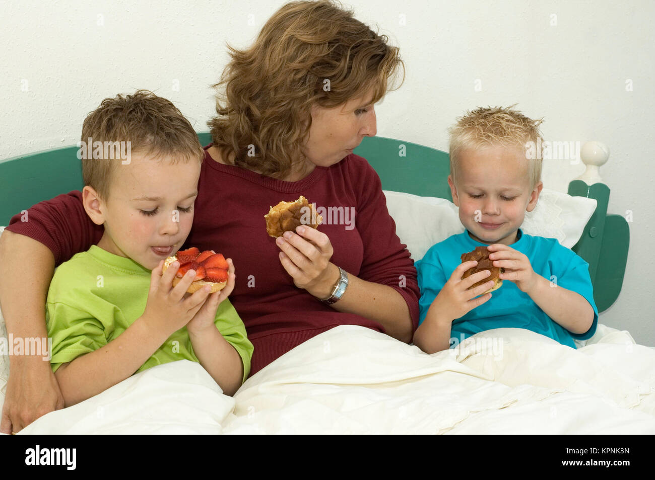 Eating A Raisin Bun Stock Photo - Alamy