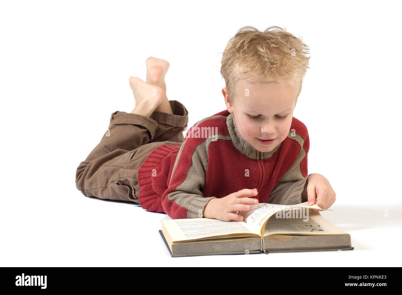 Boy reading a book 2 Stock Photo - Alamy