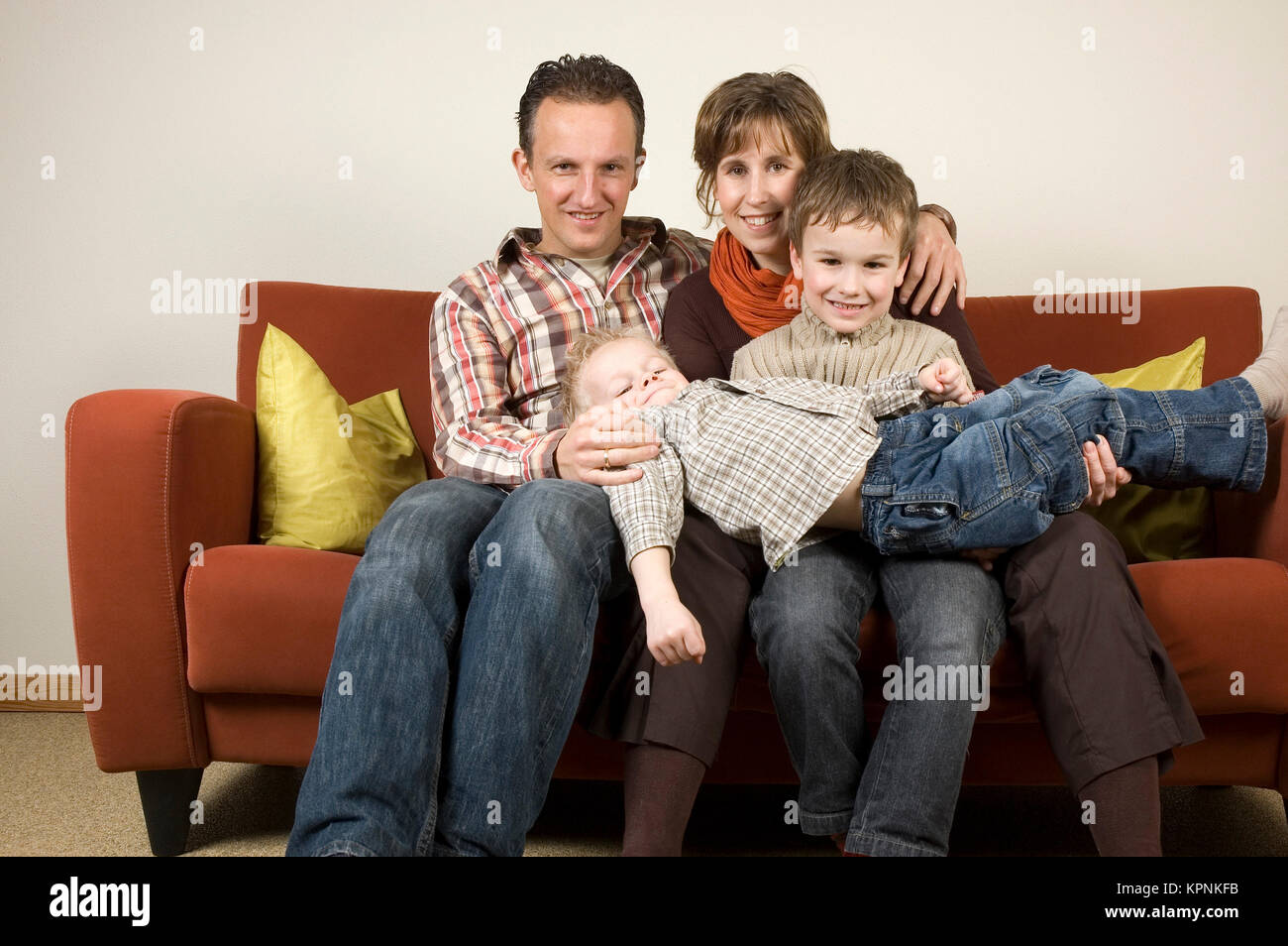 Family On A Couch 5 Stock Photo - Alamy