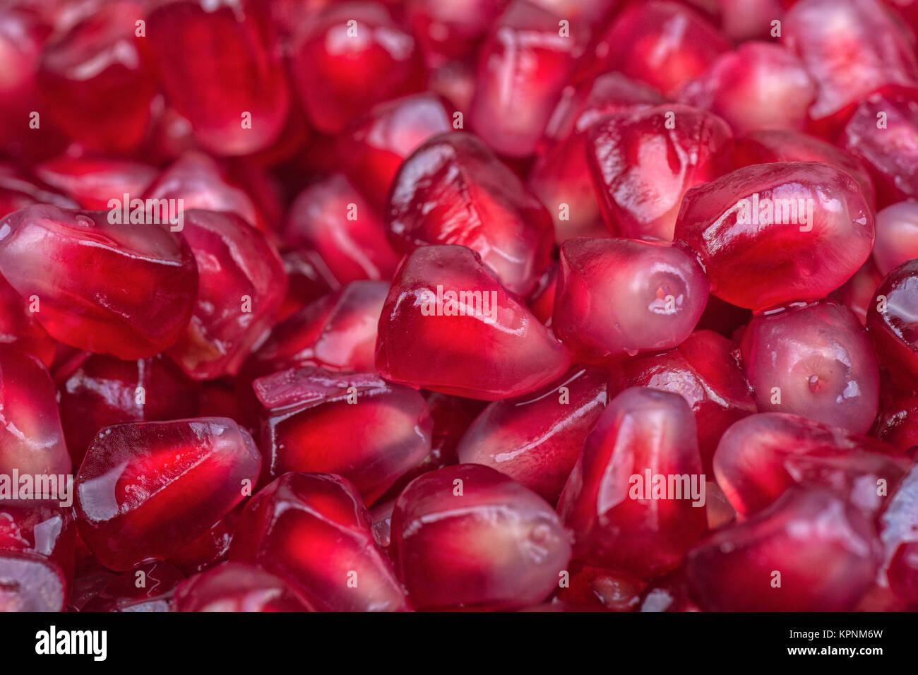 Fresh organic pomegranate seeds Stock Photo - Alamy