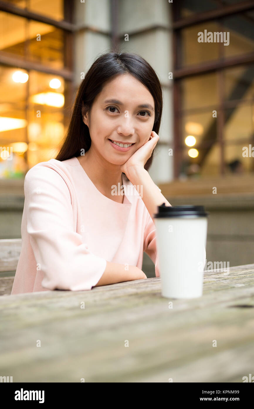 Woman enjoy her coffee at cafe Stock Photo - Alamy