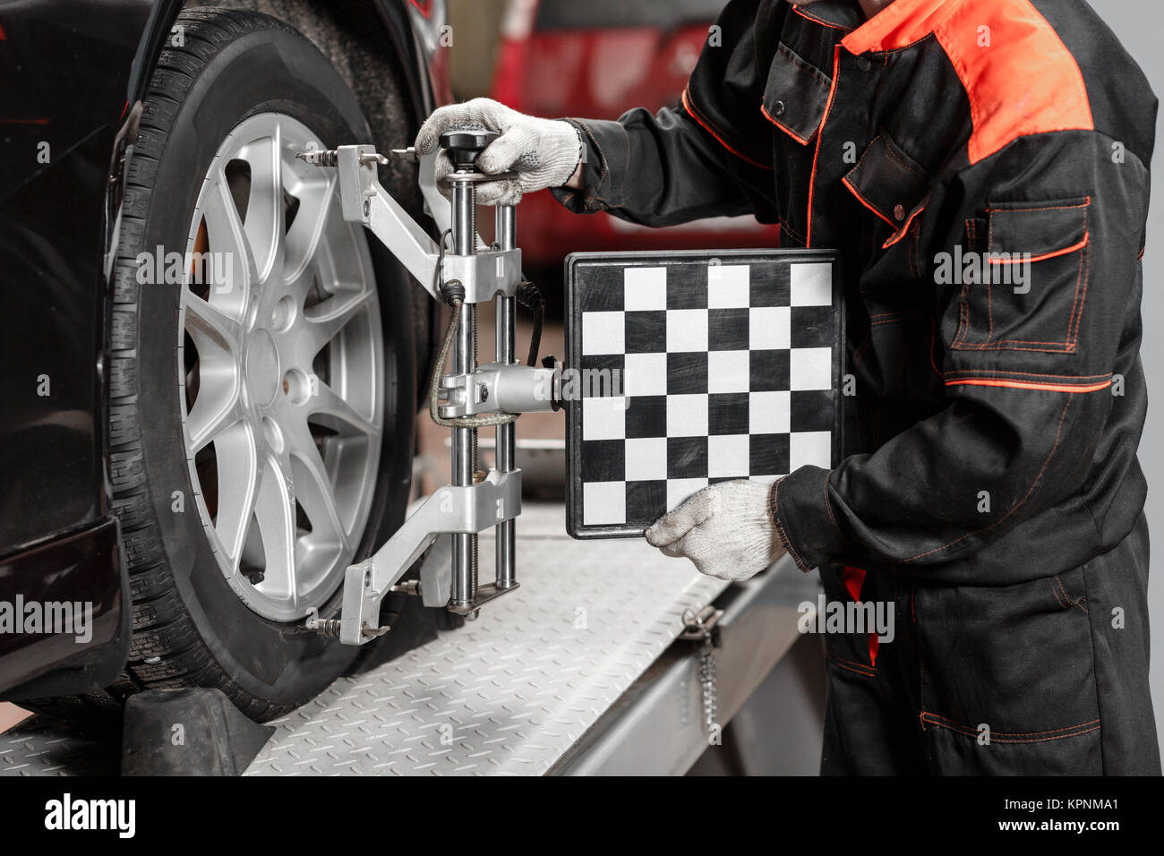 auto mechanic sets the car for diagnostics and configuration. Wheel ...