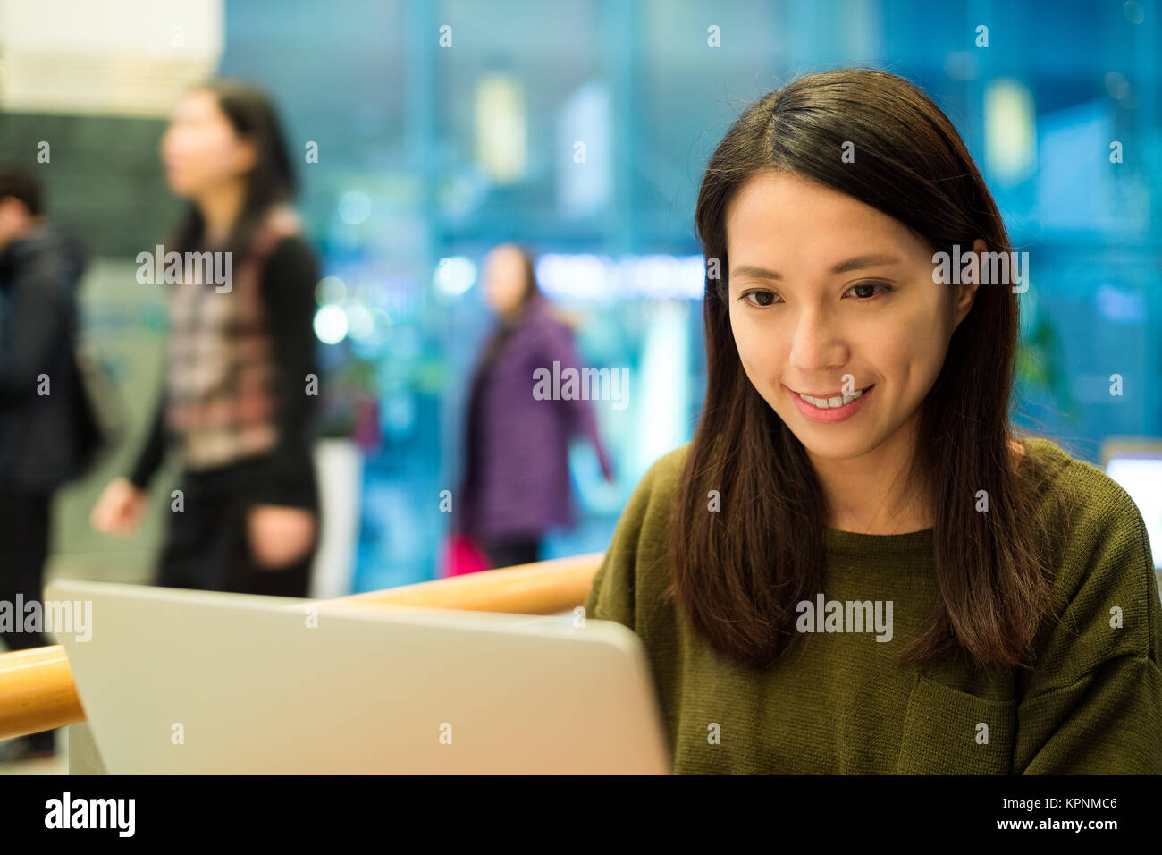 Woman working on laptop computer Stock Photo - Alamy
