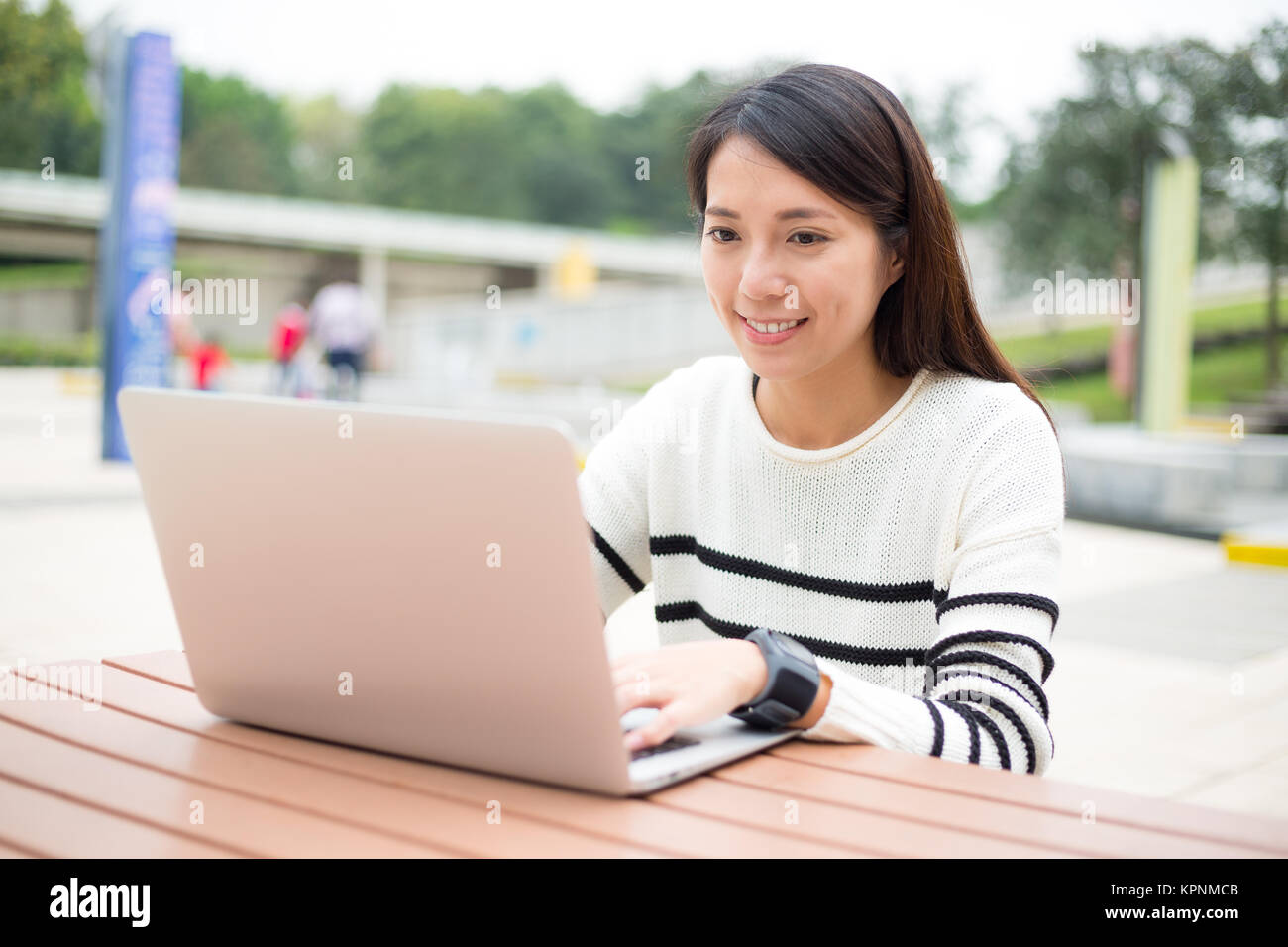 Woman connect smart watch and laptop computer Stock Photo - Alamy