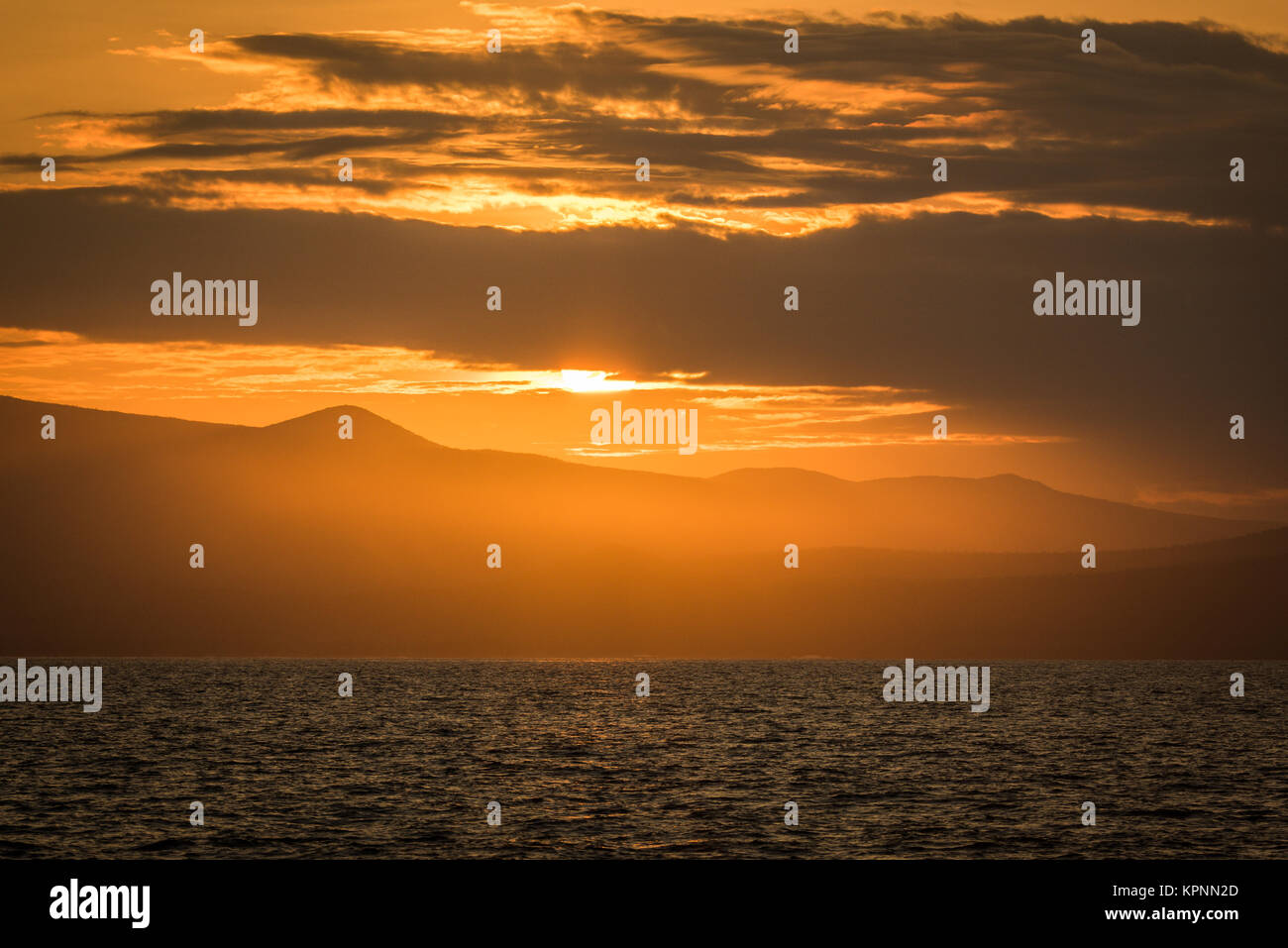 Orange sunrise ocean mountains hi-res stock photography and images - Alamy