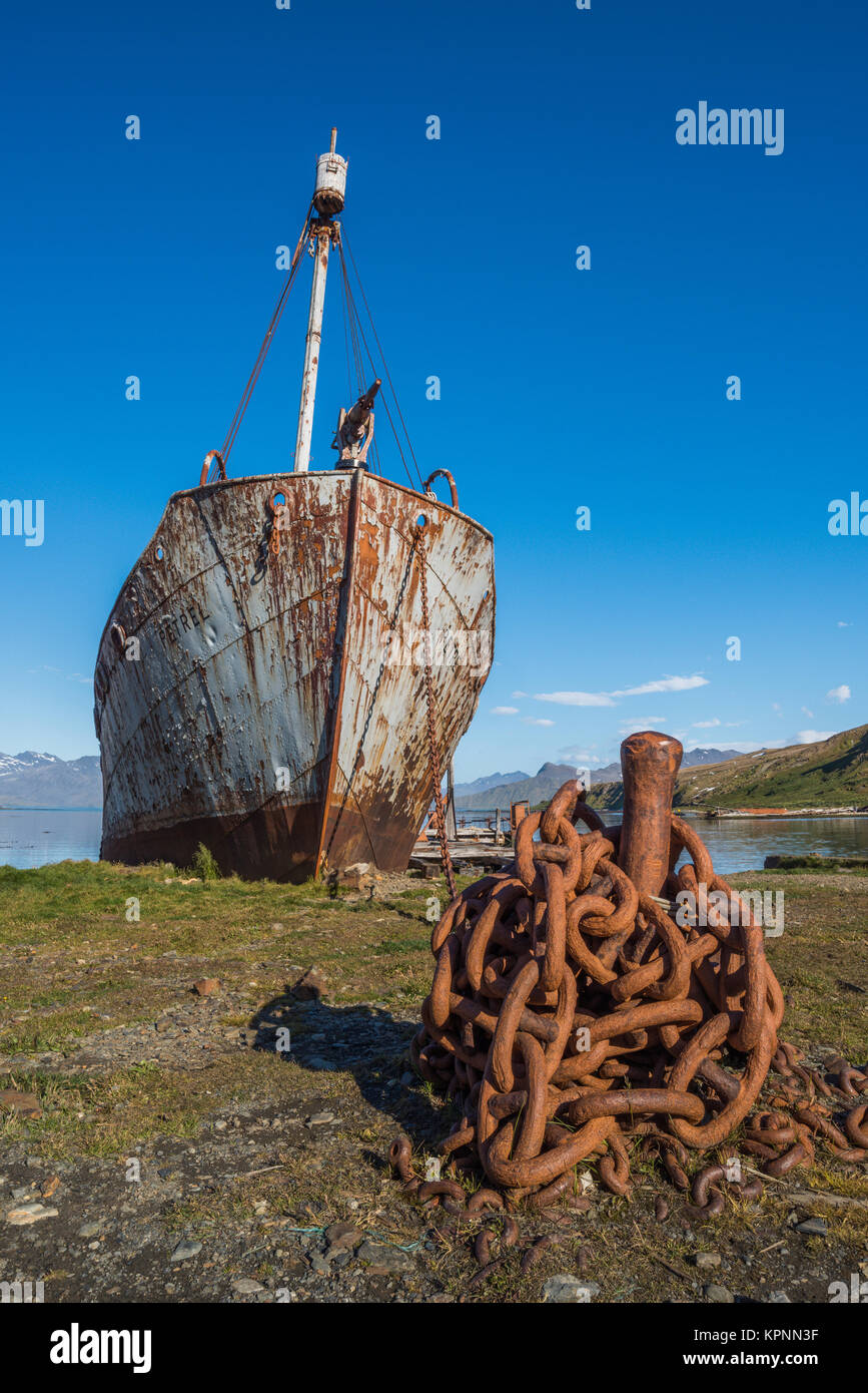 Rusty old whaler chained to iron post Stock Photo - Alamy