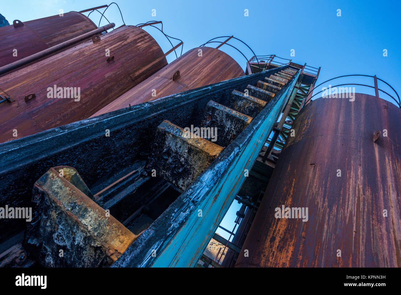 Rusty storage tanks with steps to top Stock Photo - Alamy