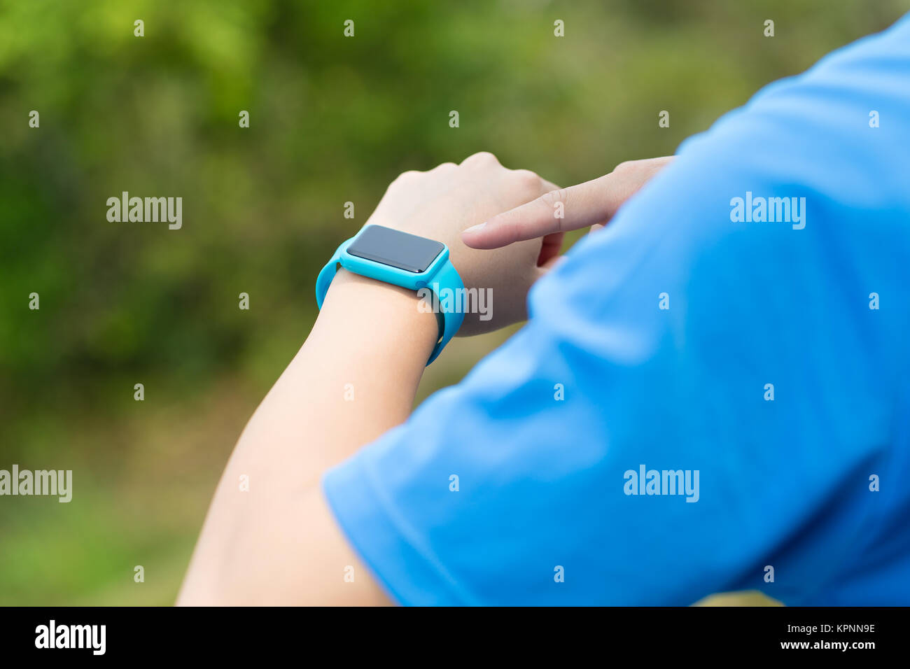Man using smartwatch with sporty wear Stock Photo - Alamy