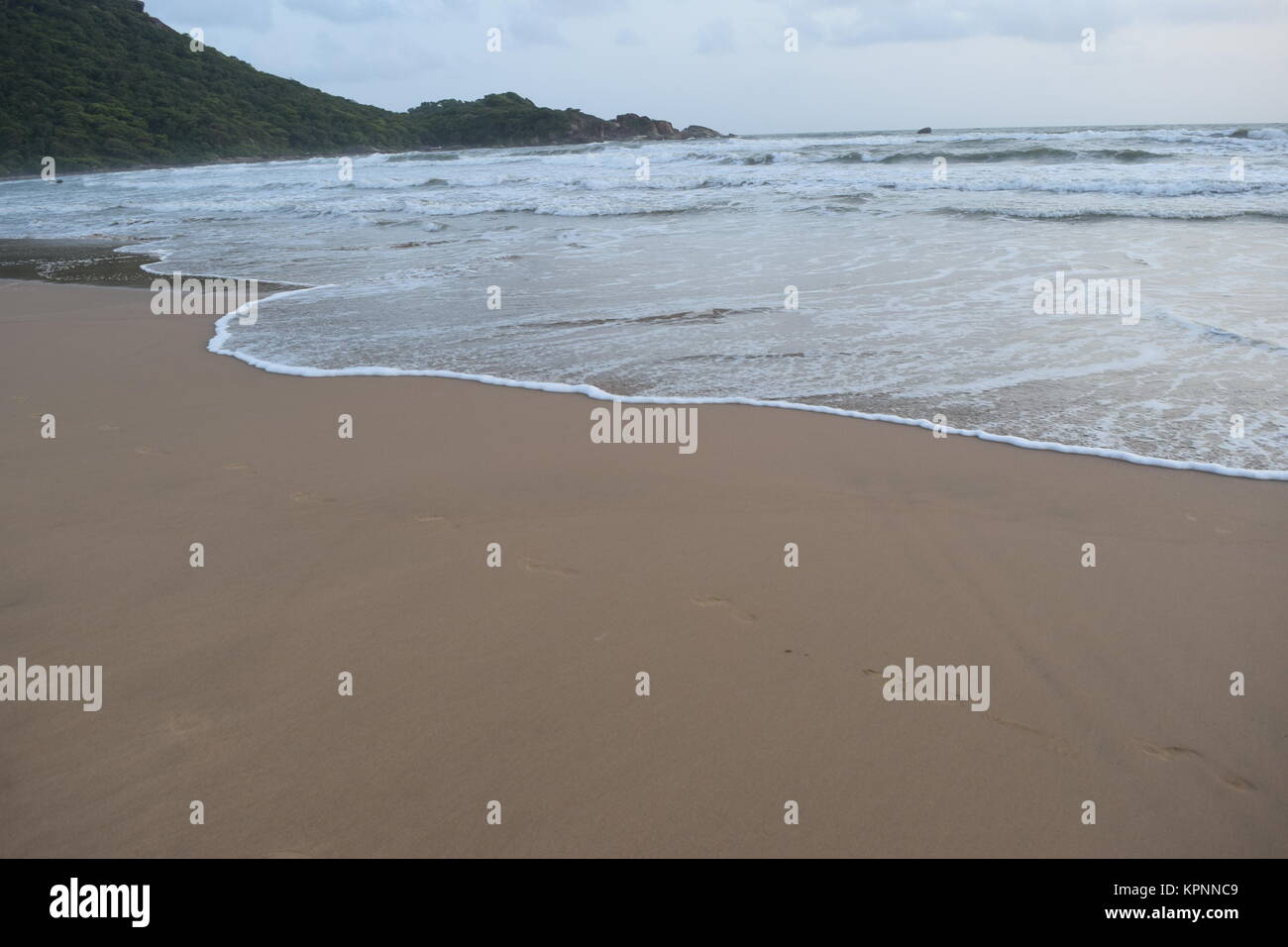 Nice sandy beach view with clouds in sky. Cloudy day with calm sandy ...