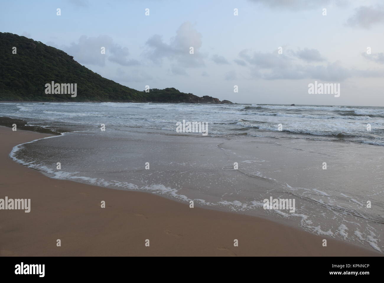 Nice sandy beach view with clouds in sky. Cloudy day with calm sandy ...