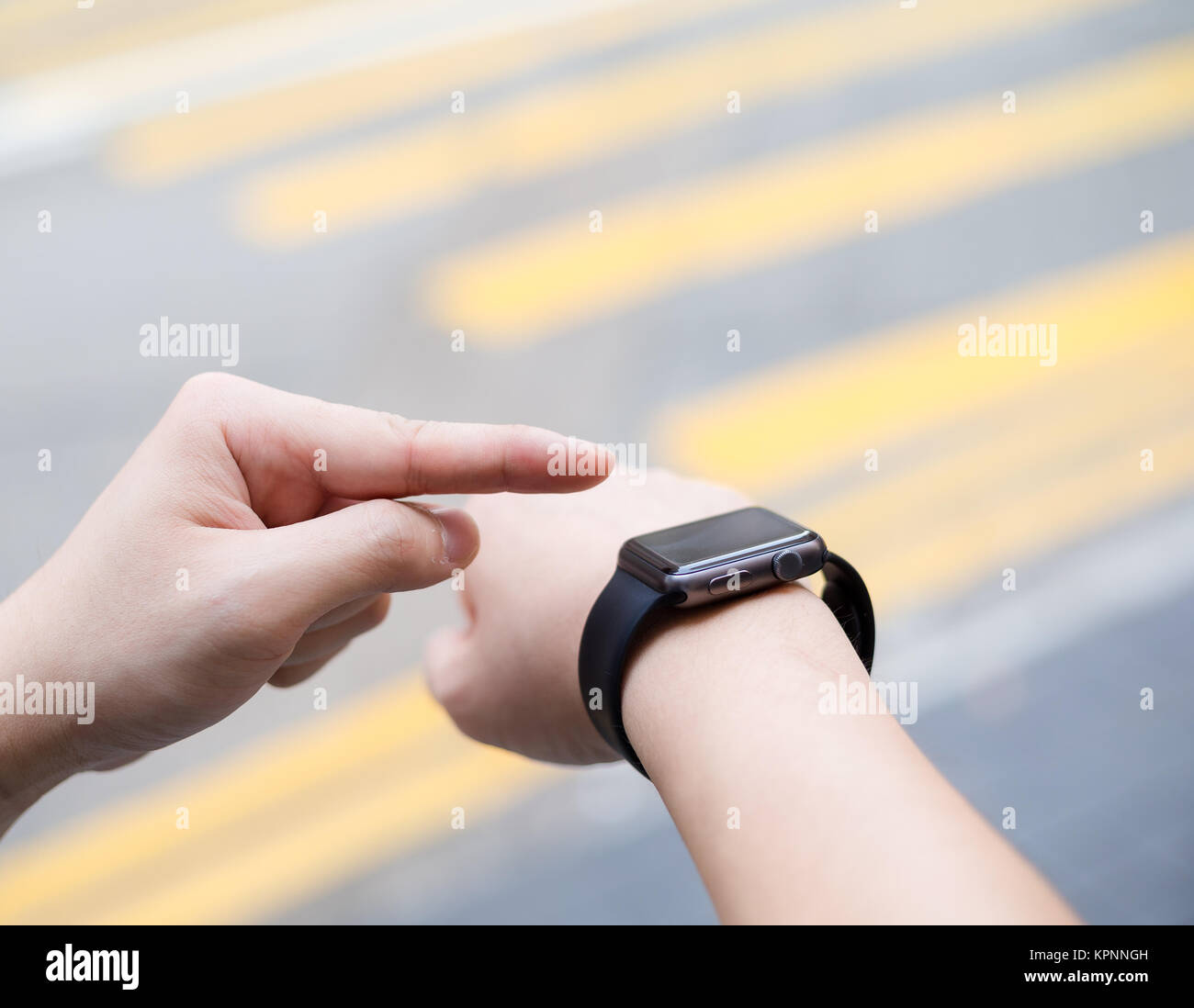 Man finger touching the screen of the smart watch Stock Photo - Alamy