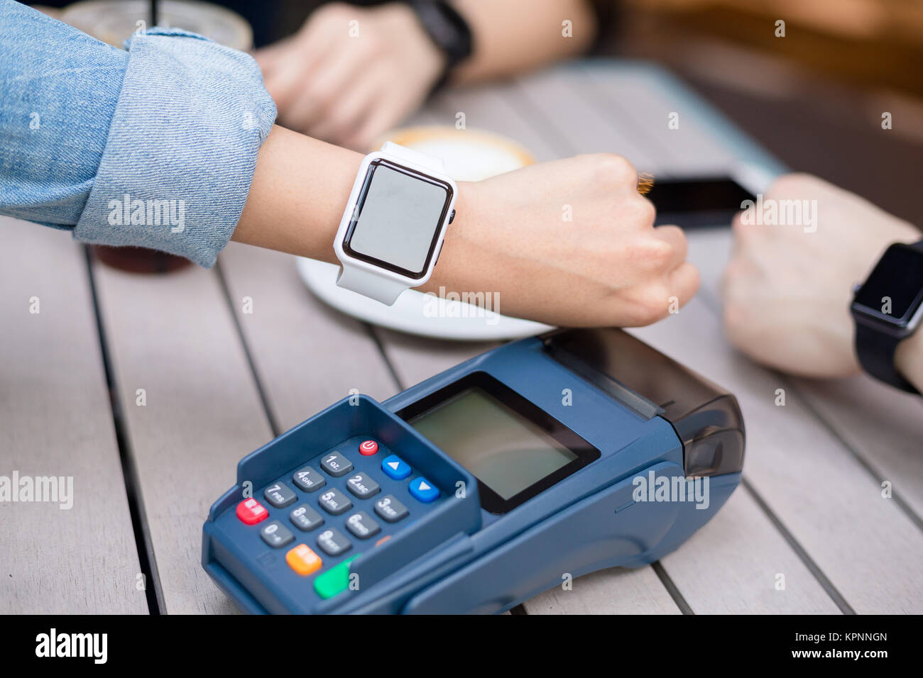 Woman pay by smart watch with NFC technology Stock Photo - Alamy