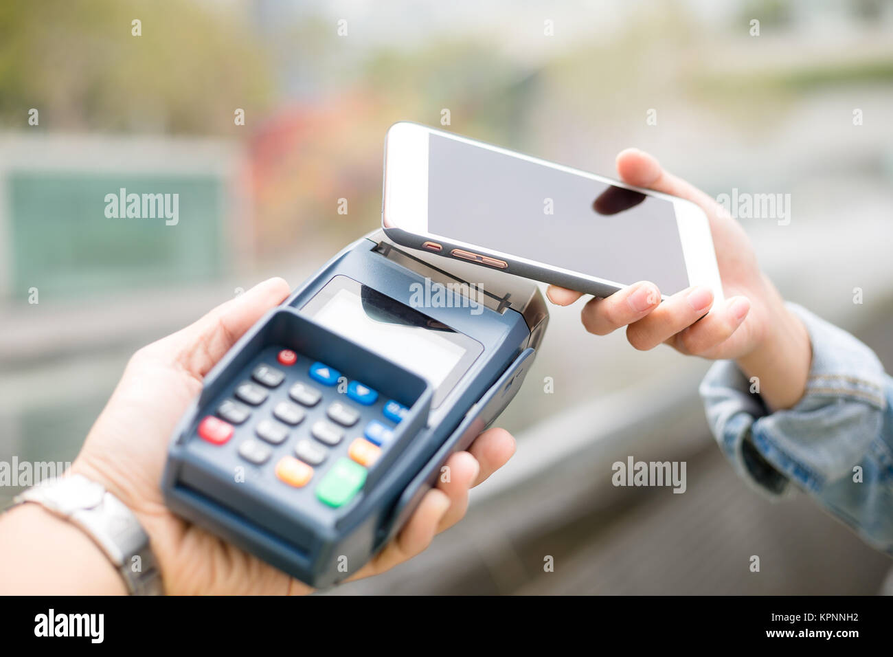 Customer using mobile phone for pay by the bill Stock Photo - Alamy