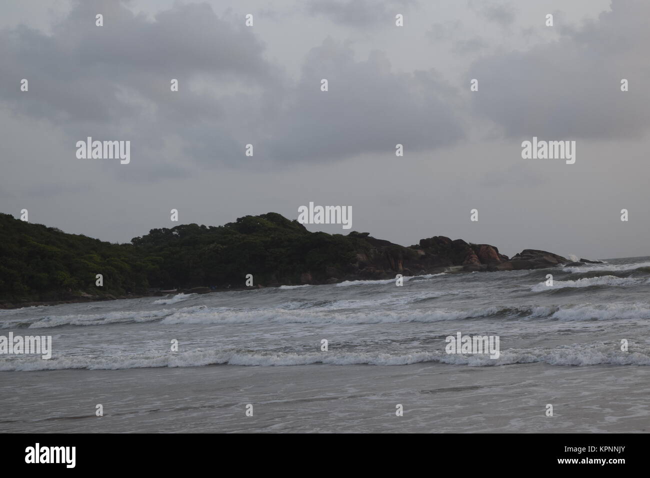 Nice sandy beach view with clouds in sky. Cloudy day with calm sandy ...