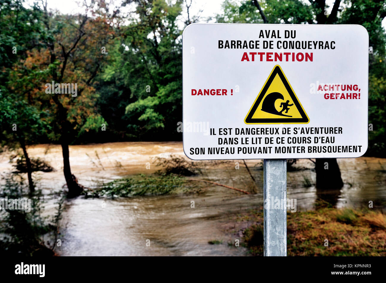Sign warning of the danger of dam water upstream dropped Stock Photo ...