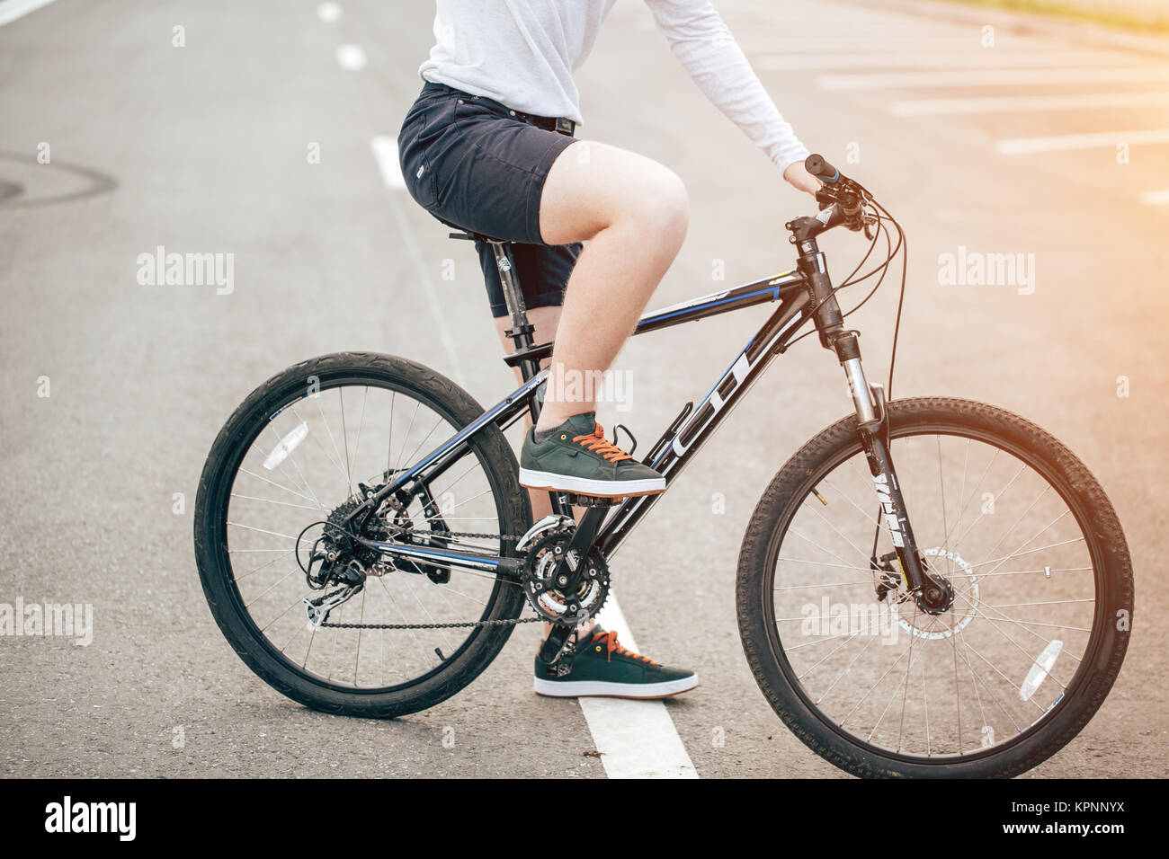 Businessman riding bicycle to work on urban street in morning Stock ...
