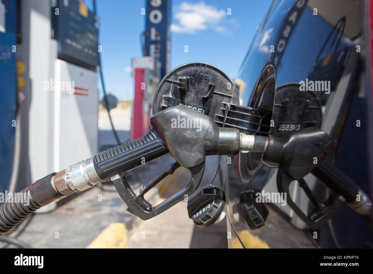 Man pumping gasoline fuel in car Stock Photo - Alamy