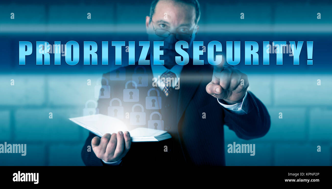 Industry Professional Touching PRIORITIZE SECURITY! Stock Photo - Alamy