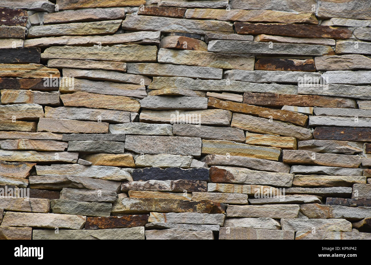 Old stone layered wall Stock Photo - Alamy