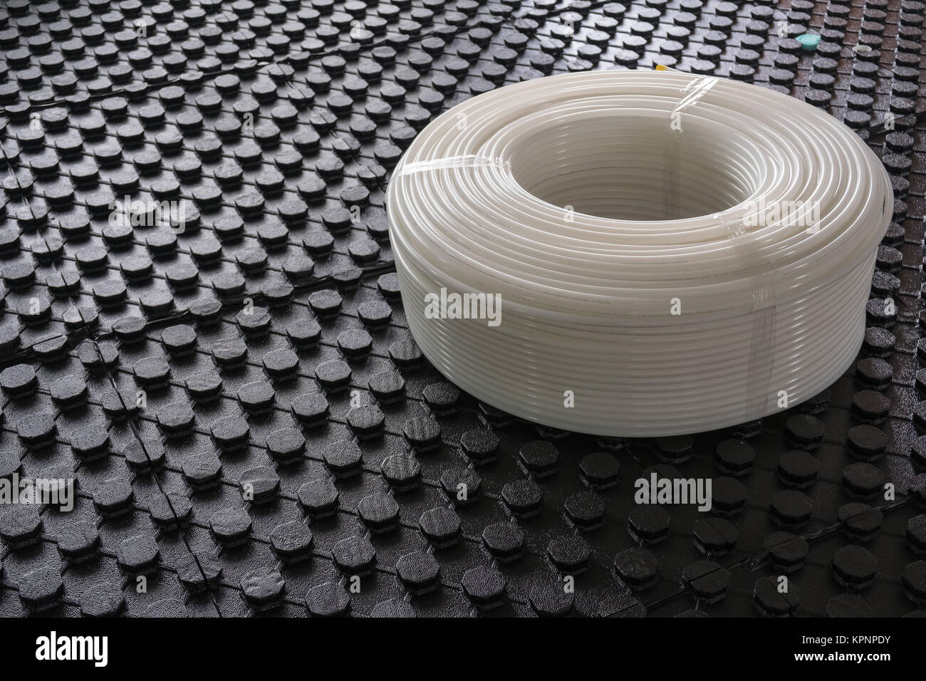 Radiant underfloor heating insulation boards with flexible tubing ...