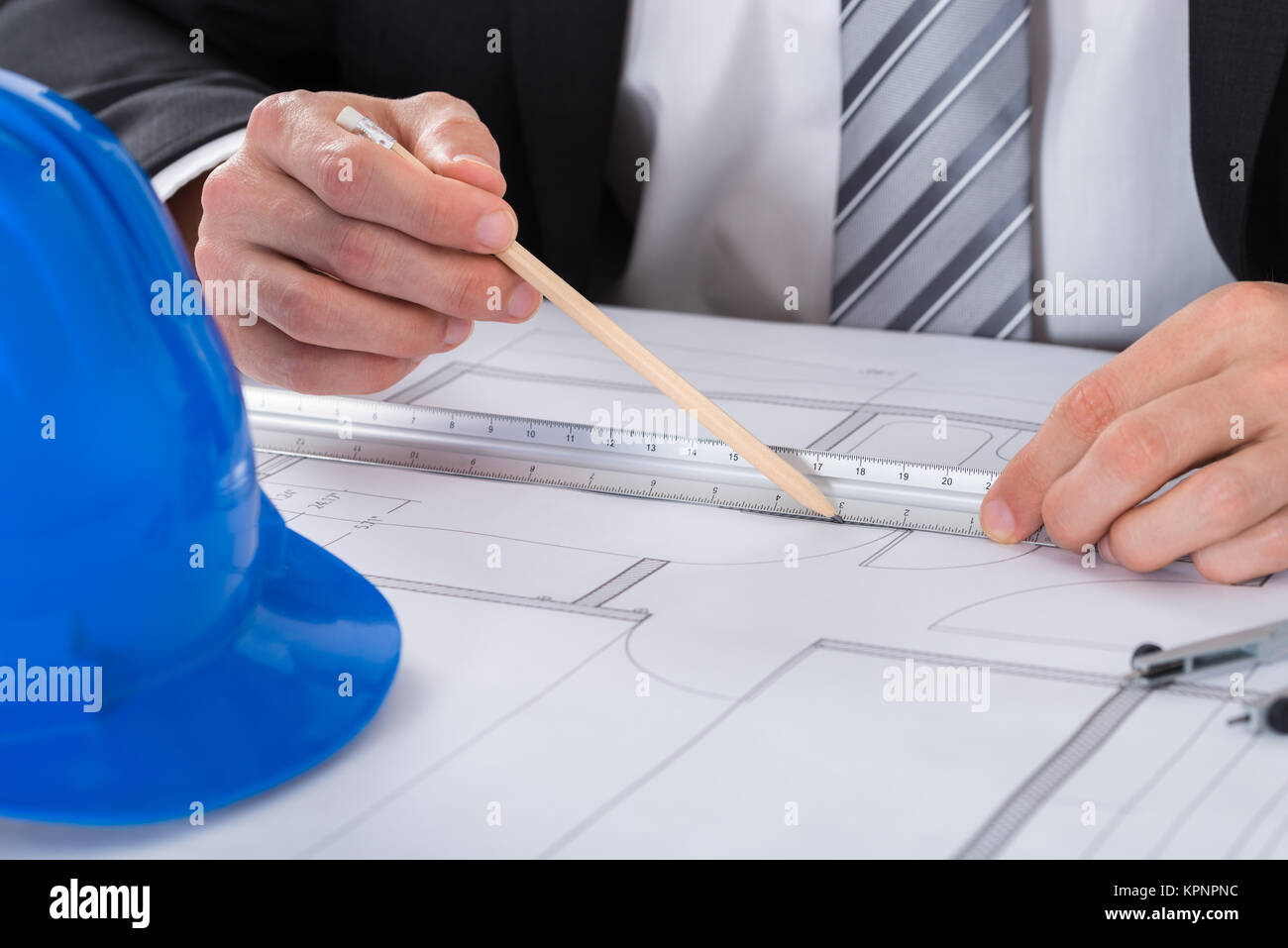 Male Architect Hand Using Pencil And Ruler On Blueprint Stock Photo - Alamy