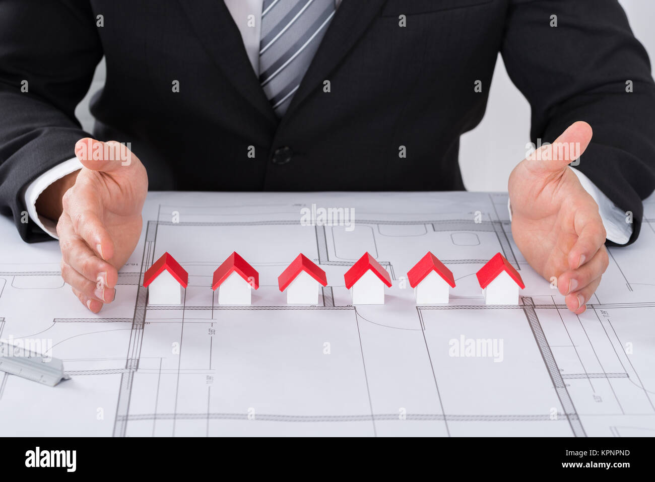 Architect Hand Protecting House Models Stock Photo - Alamy