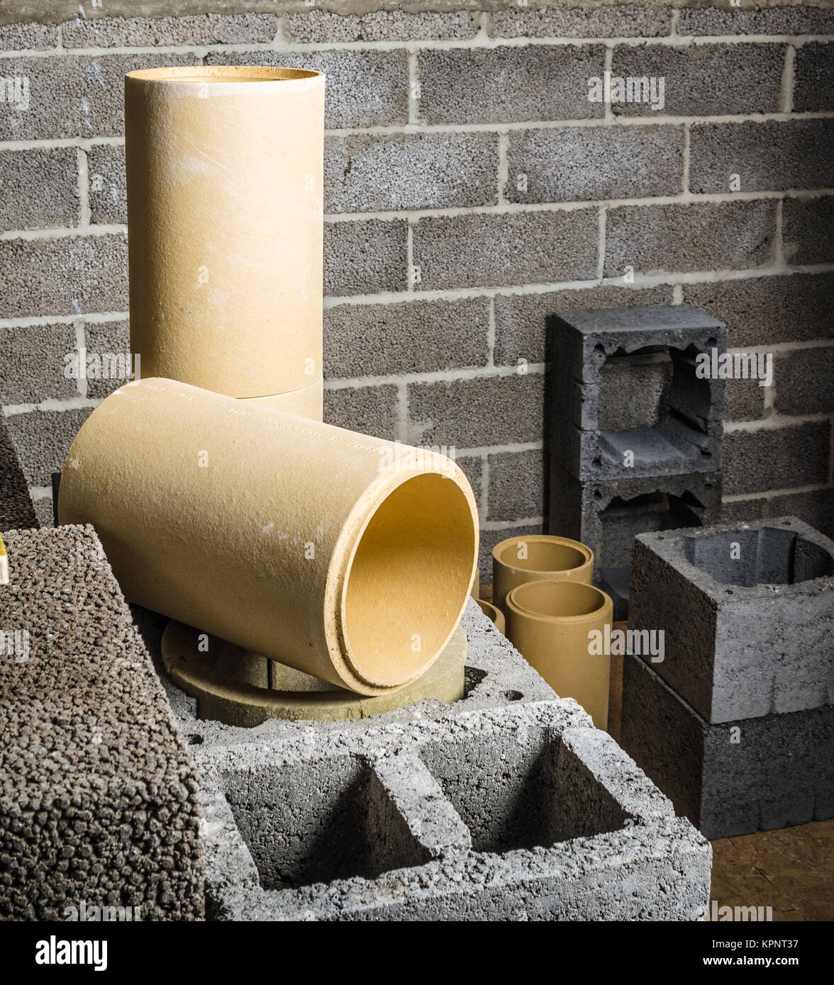 Construction of modular ceramic chimney in the house Stock Photo - Alamy