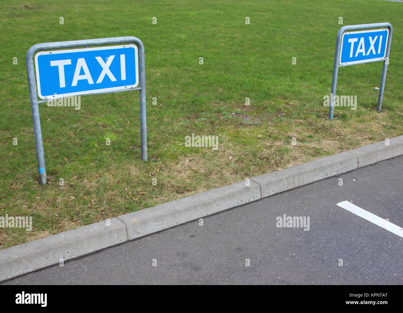 Taxi Signs at Empty Parking Place in Perspective Stock Photo - Alamy