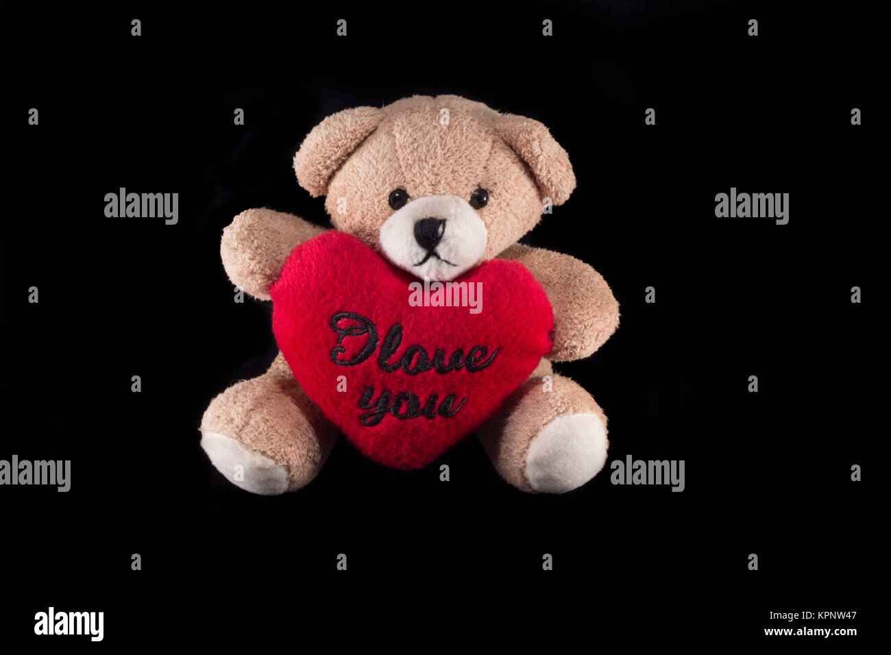 Teddy bear with red heart Stock Photo - Alamy