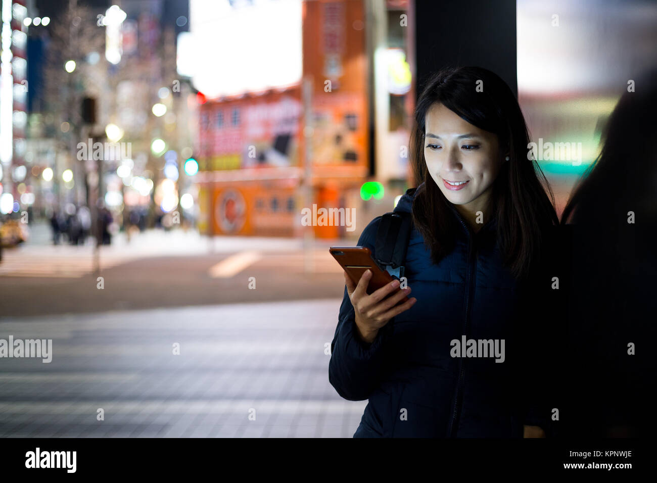Woman use of mobile phone at night Stock Photo - Alamy