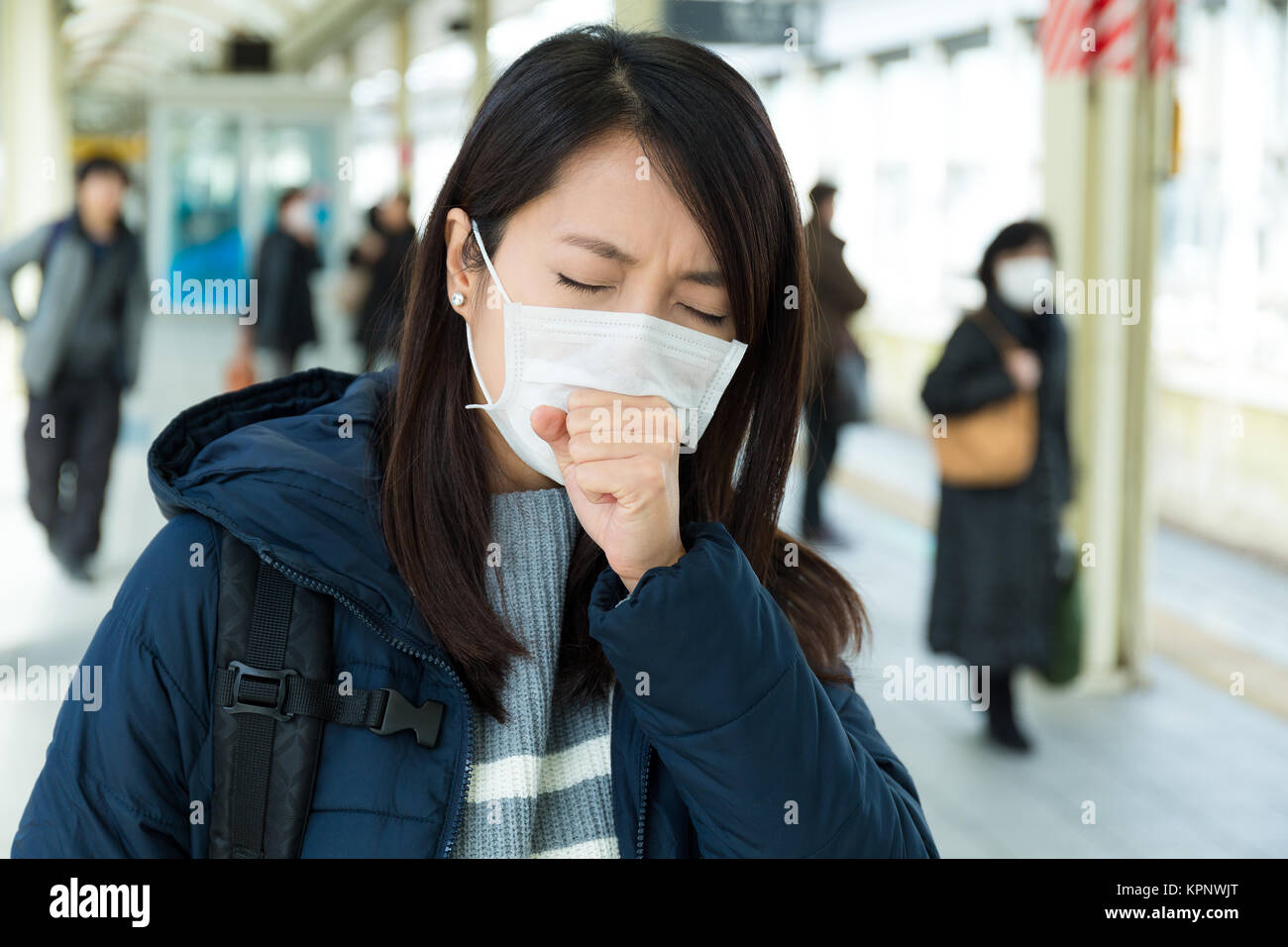 Woman feeling unwell in trains station Stock Photo - Alamy