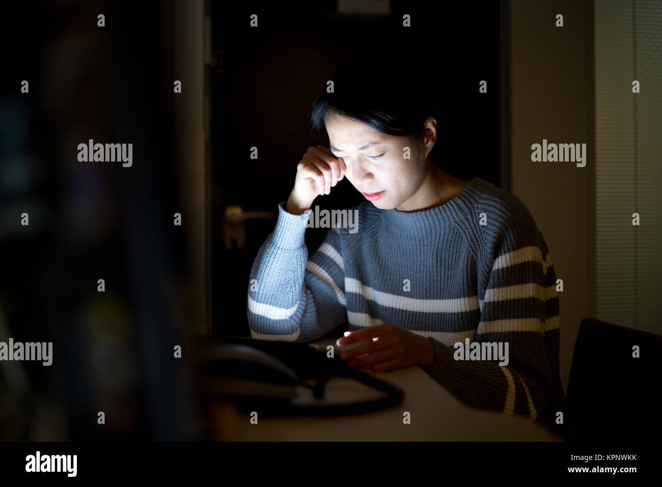 Woman feeling tried for looking on tablet Stock Photo - Alamy