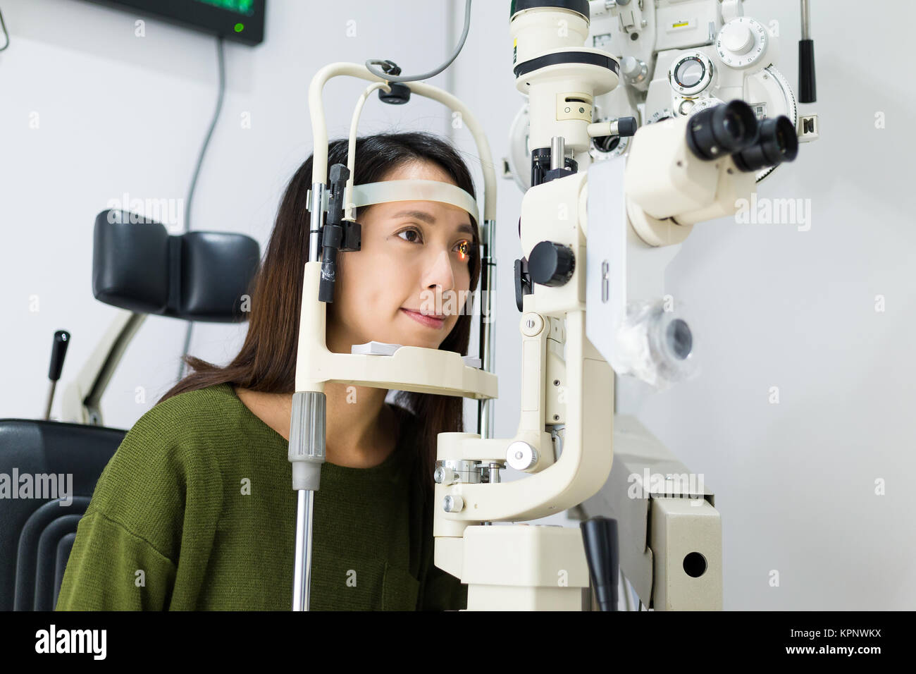 Patient during an eye examination in eye clinic Stock Photo - Alamy