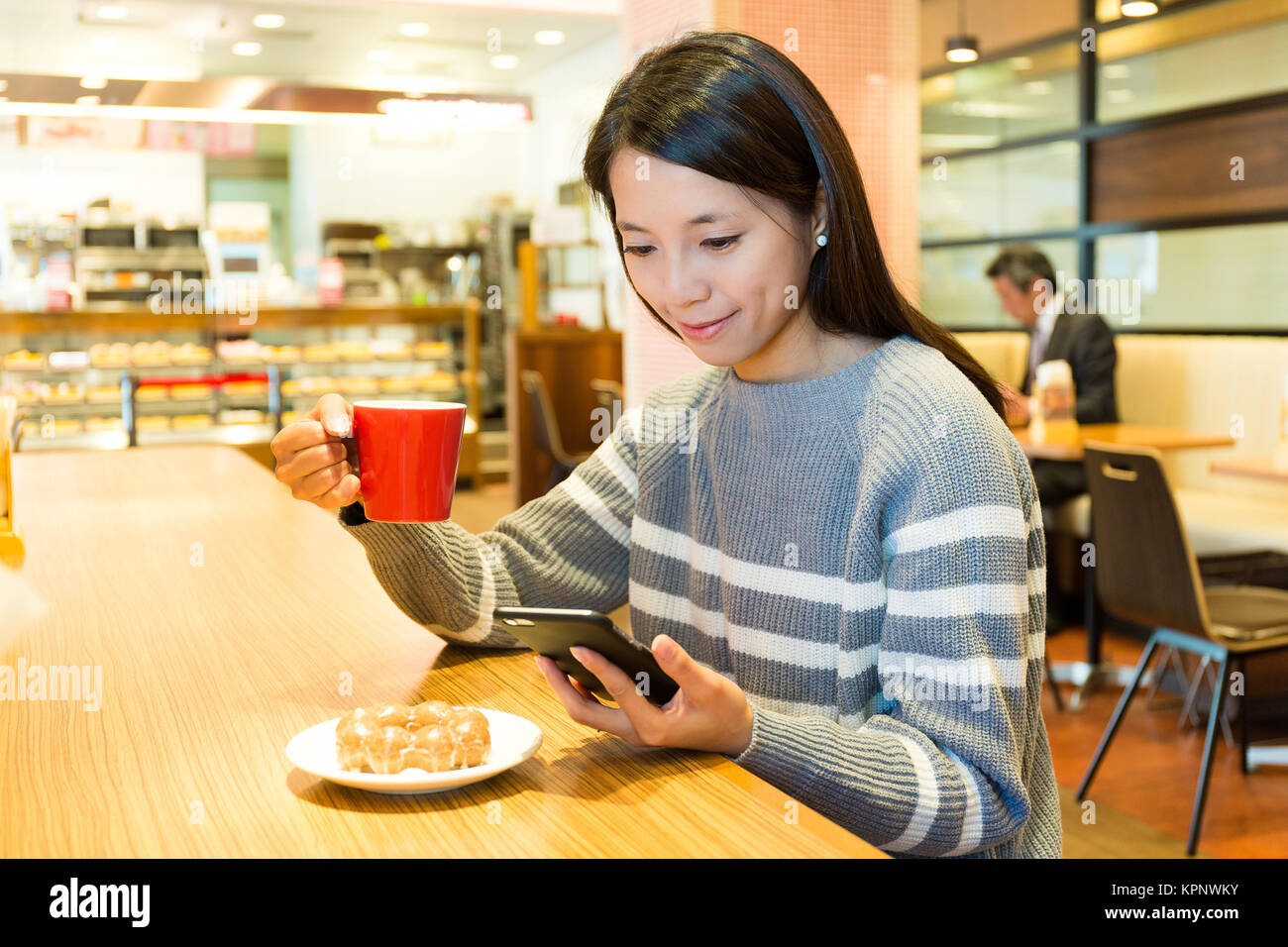 Woman enjoy drink of coffee at morning cafe Stock Photo - Alamy