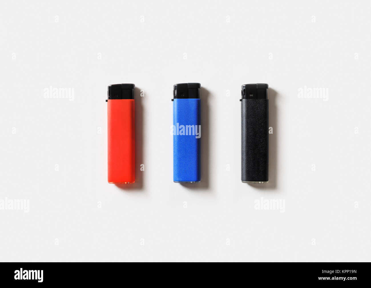 Blank plastic gas lighters on white paper background. Flat lay Stock ...