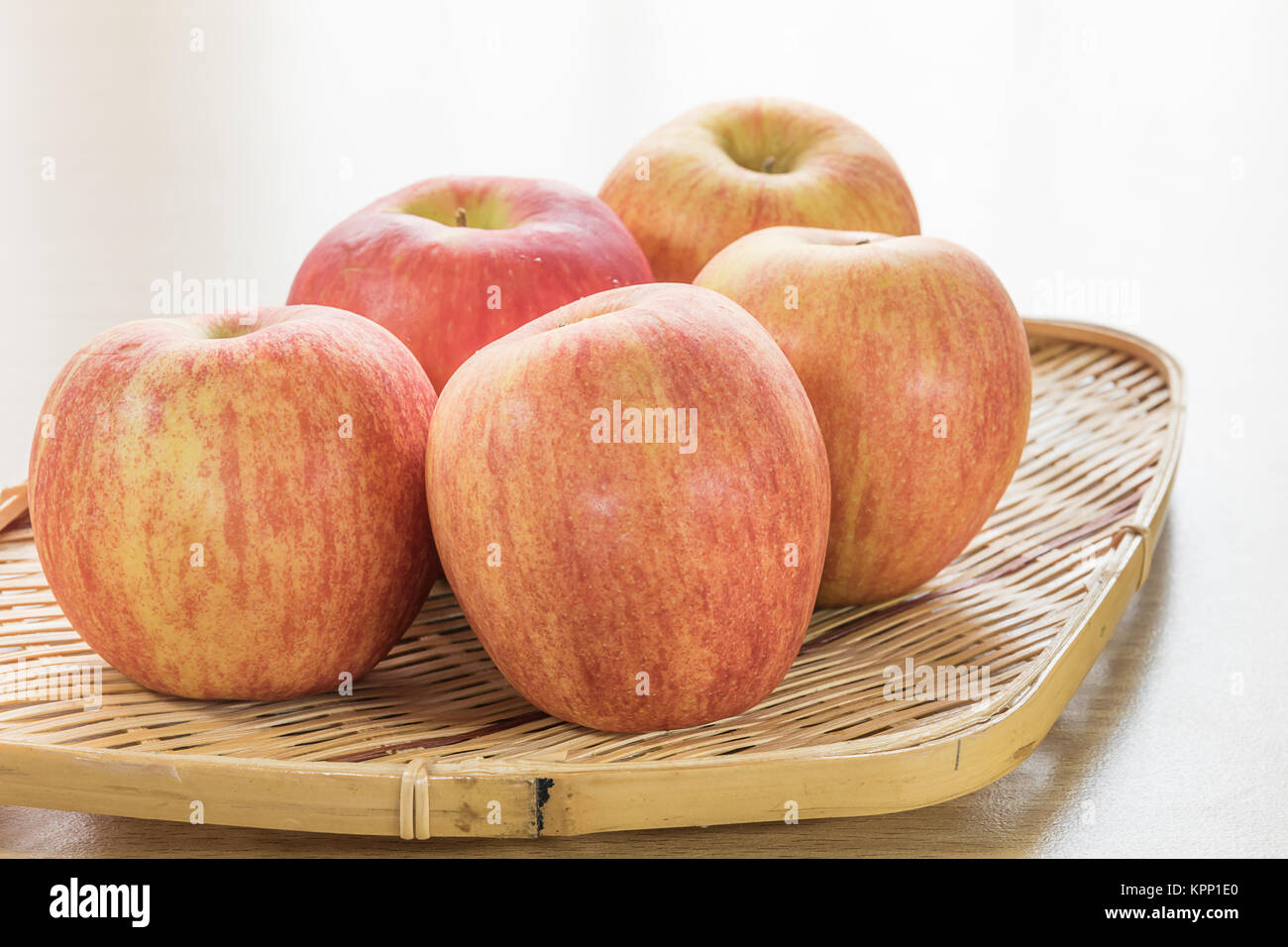 Red apple in basket Stock Photo - Alamy