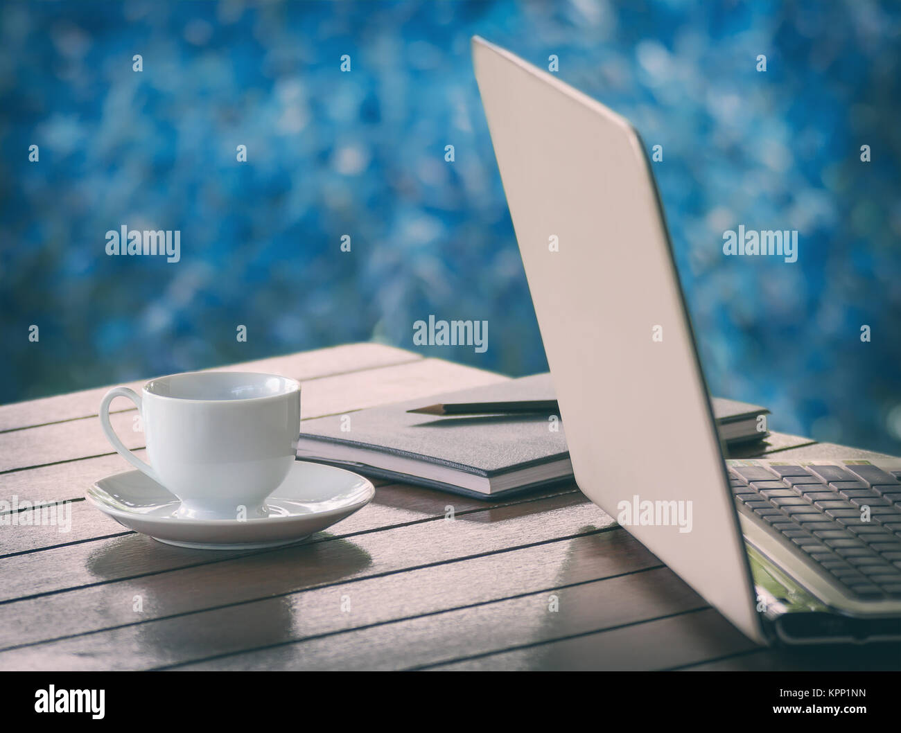 Cup of coffee and laptop Stock Photo - Alamy